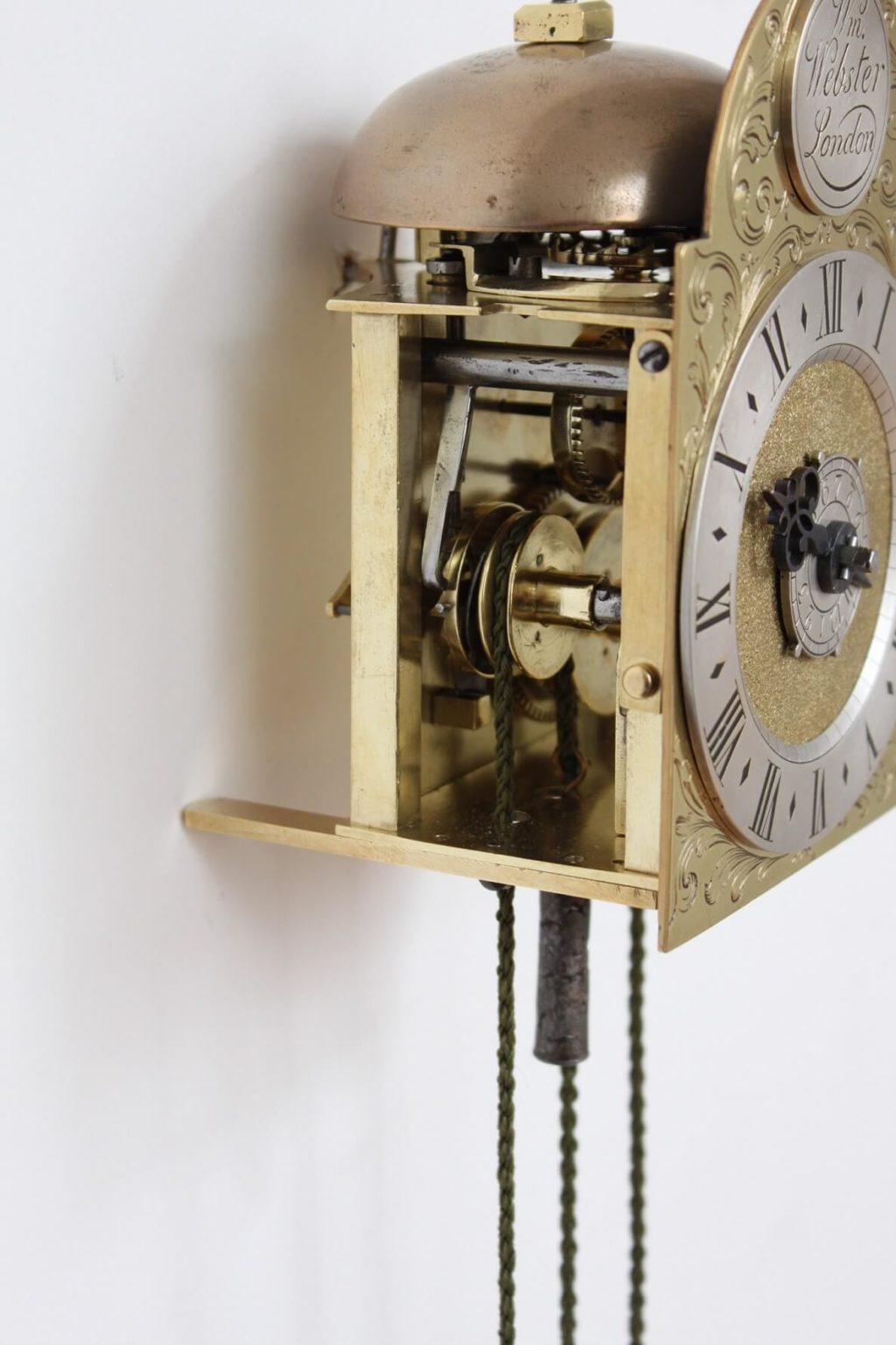 A rare and small English brass travel wall clock, William Webster ...