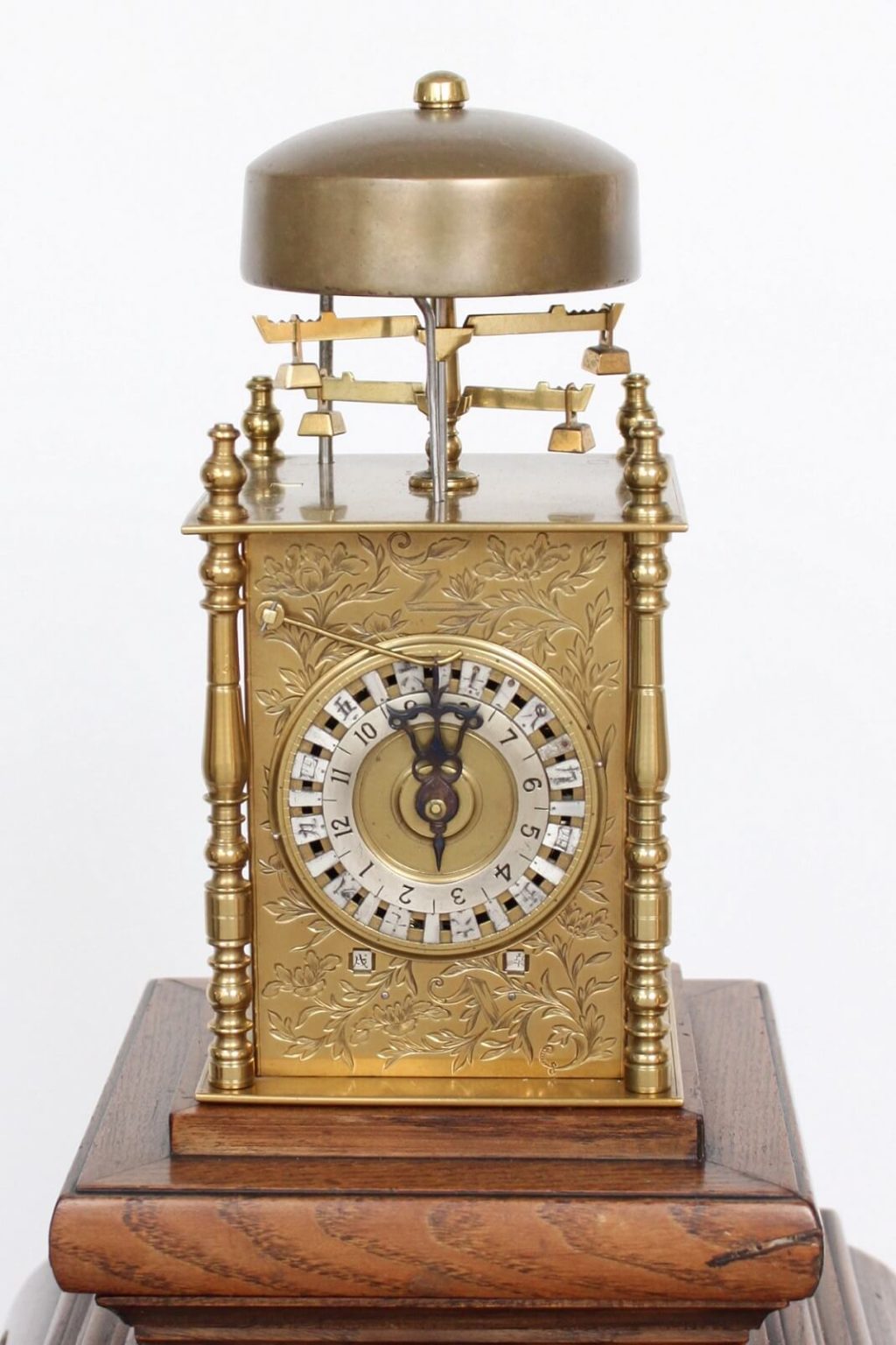 An attractive Japanese engraved brass 'Yagura Dokei' lantern clock on ...