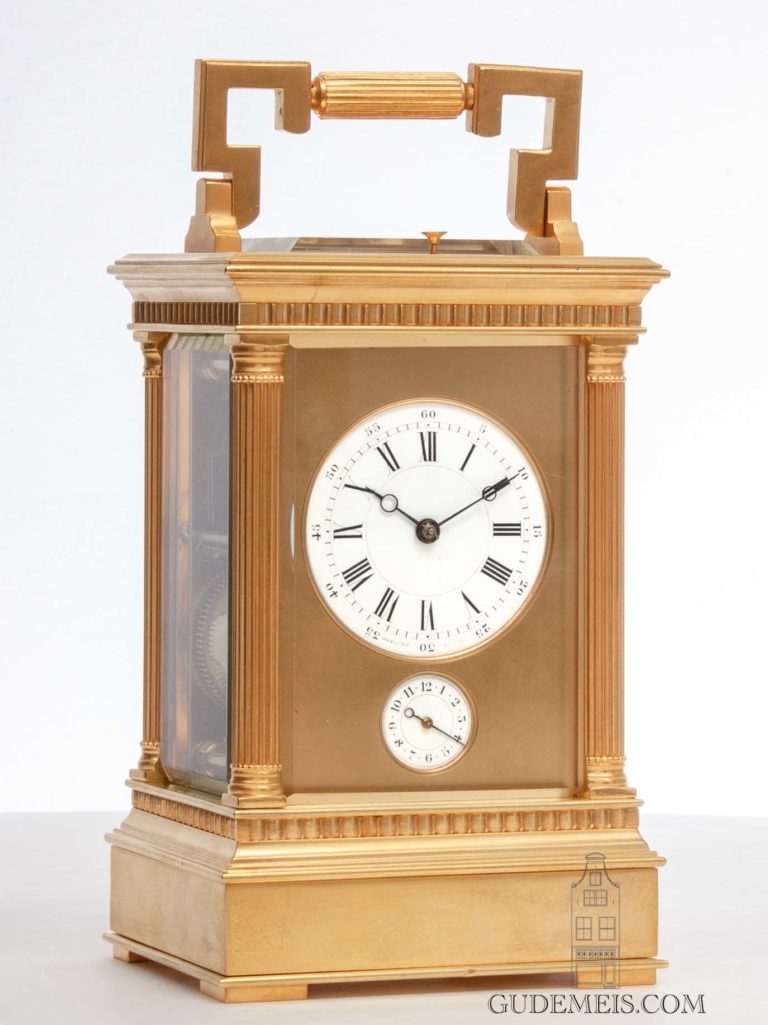 A very rare French gilt striking carriage clock and musical mechanism ...