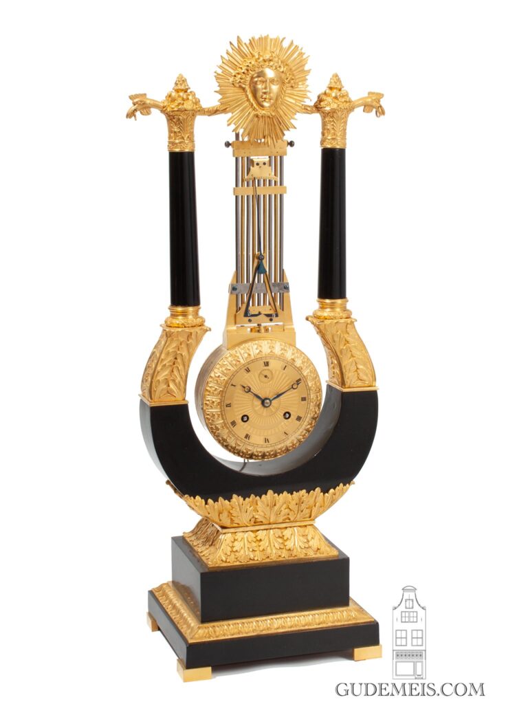 A French Charles X ormolu mounted mantel clock with oscillating ...