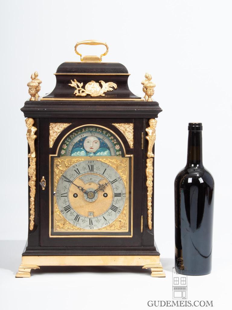 A small Dutch ebonized table clock with date and moon phase, F. Van ...