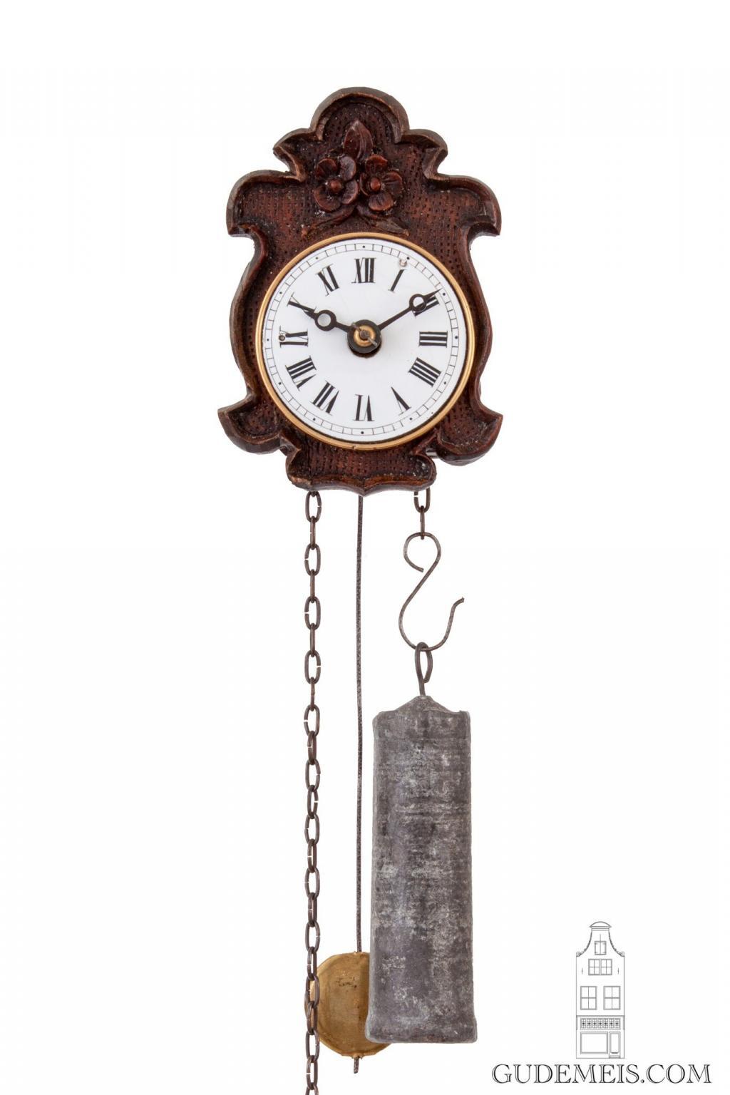 A rare small German Black Forest carved wall clock, Felix Faller, circa ...
